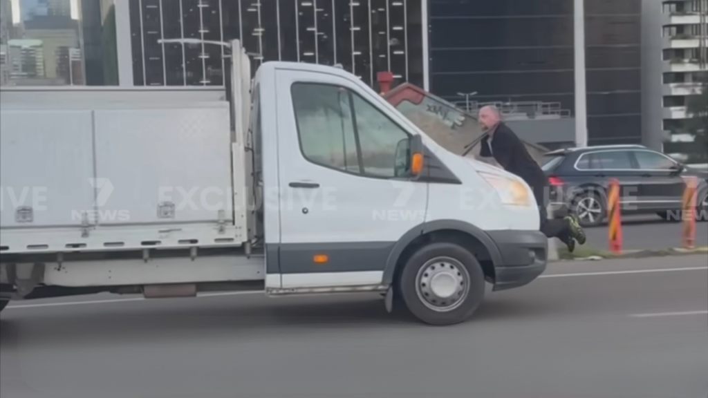 Man Rides on Hood of Moving Van on Highway in Road Rage Incident