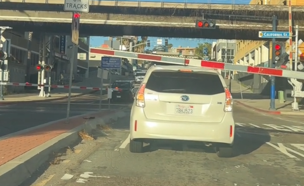 Driver Inches Toward Oncoming Train at Railroad Crossing in Viral Video ...